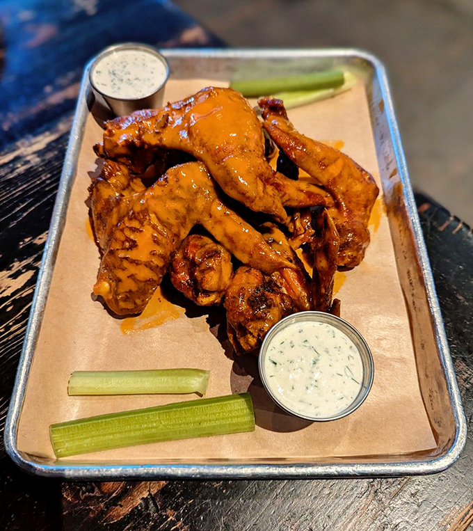 These golden wings arrive like edible sunshine, promising heat that builds with every glorious bite.