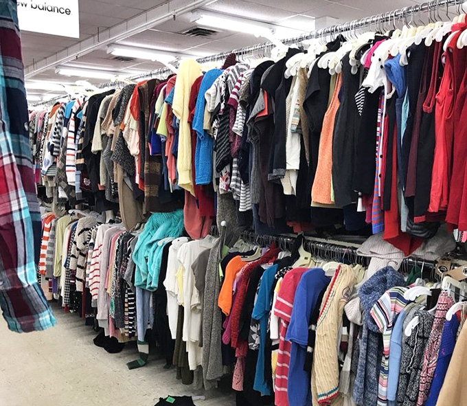 Rainbow rows of children's clothing await new adventures. Like a candy store, but the sugar high comes from those sweet, sweet savings.