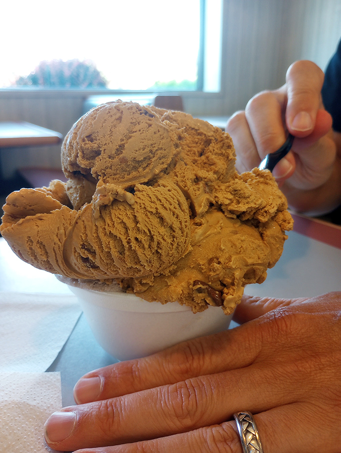 Coffee ice cream stacked higher than my morning caffeine needs. The kind of generous scooping that makes you believe in humanity again.