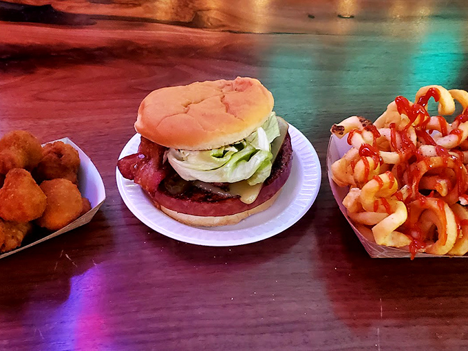 The holy trinity of tavern dining: a perfectly grilled sandwich, golden onion rings, and a side that makes you question why you'd ever eat anywhere else.