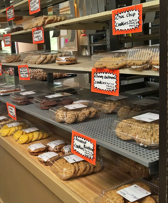 Orange signs marking chocolate chip and oatmeal cookies like tiny flags of deliciousness across the display case.