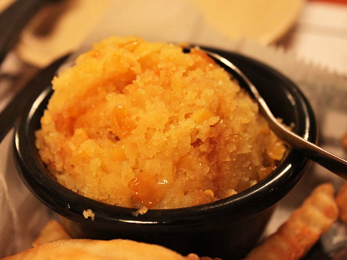 The corn souffl&eacute; glows with golden promise, sweet and savory in perfect harmony. It's the side dish that frequently gets promoted to main character.