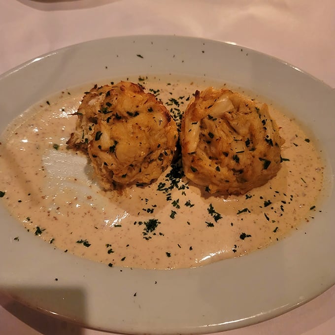 These crab cakes are what Maryland dreams about &ndash; jumbo lump, "no filler," and swimming in a sauce that deserves its own fan club.