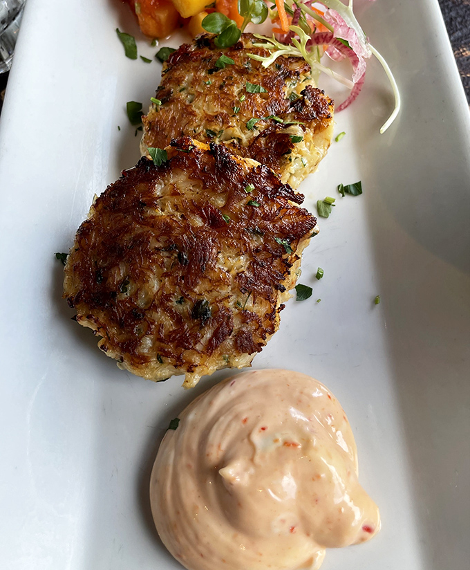 Crab cakes with the perfect sear&mdash;like they got just the right amount of sun on a Monterey beach day. That sauce isn't an accessory; it's essential equipment.