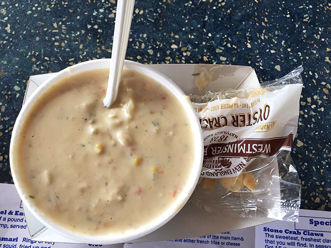 A bowl of creamy crab chowder paired with an ice-cold Modelo&mdash;proof that sometimes life's simplest pleasures are also its most profound.