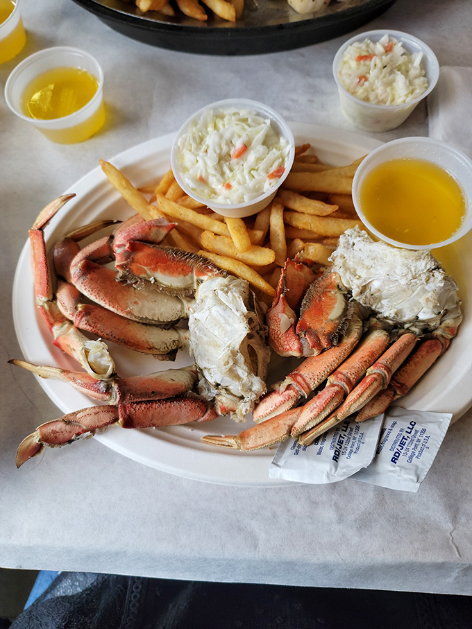 Crab legs splayed majestically across the plate like a seafood sunburst. With drawn butter and fries, it's vacation on a plate.