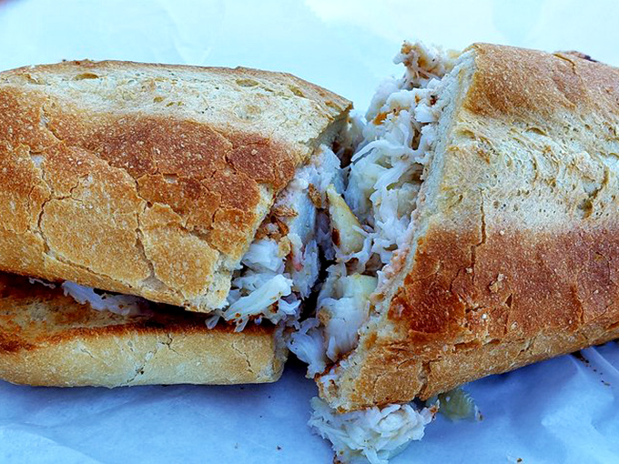 A crab sandwich so stuffed with meat it's practically structural engineering. The bread exists merely as a delivery system for oceanic bliss.