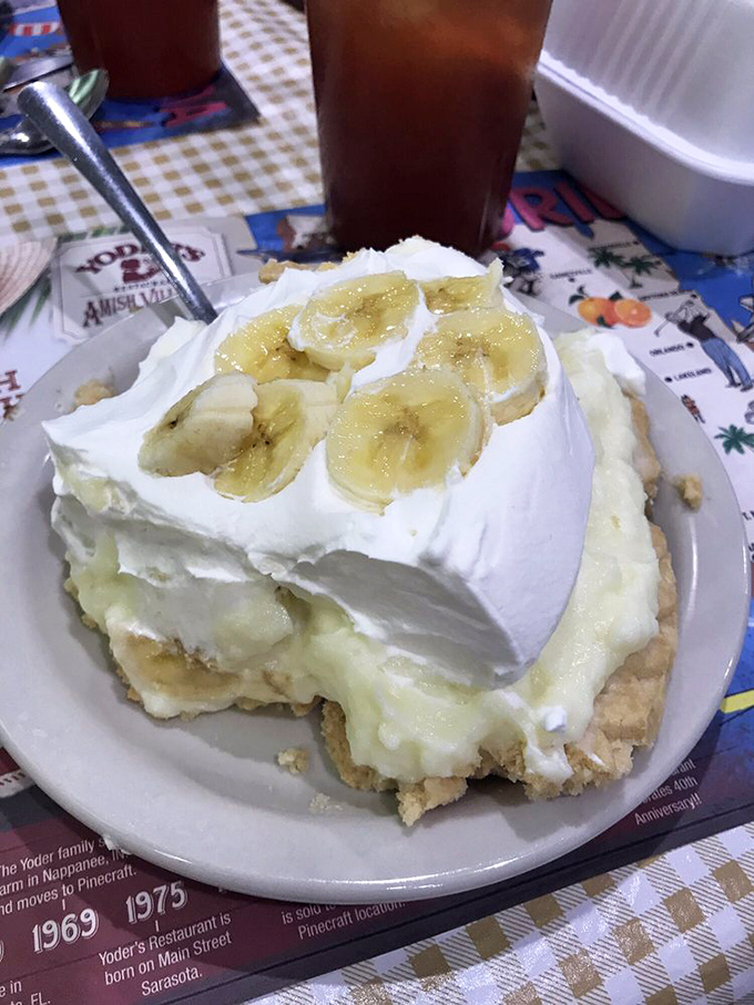 Banana cream pie that defies gravity and good sense. The whipped cream-to-filling ratio here is what mathematicians call "the golden ratio of deliciousness."