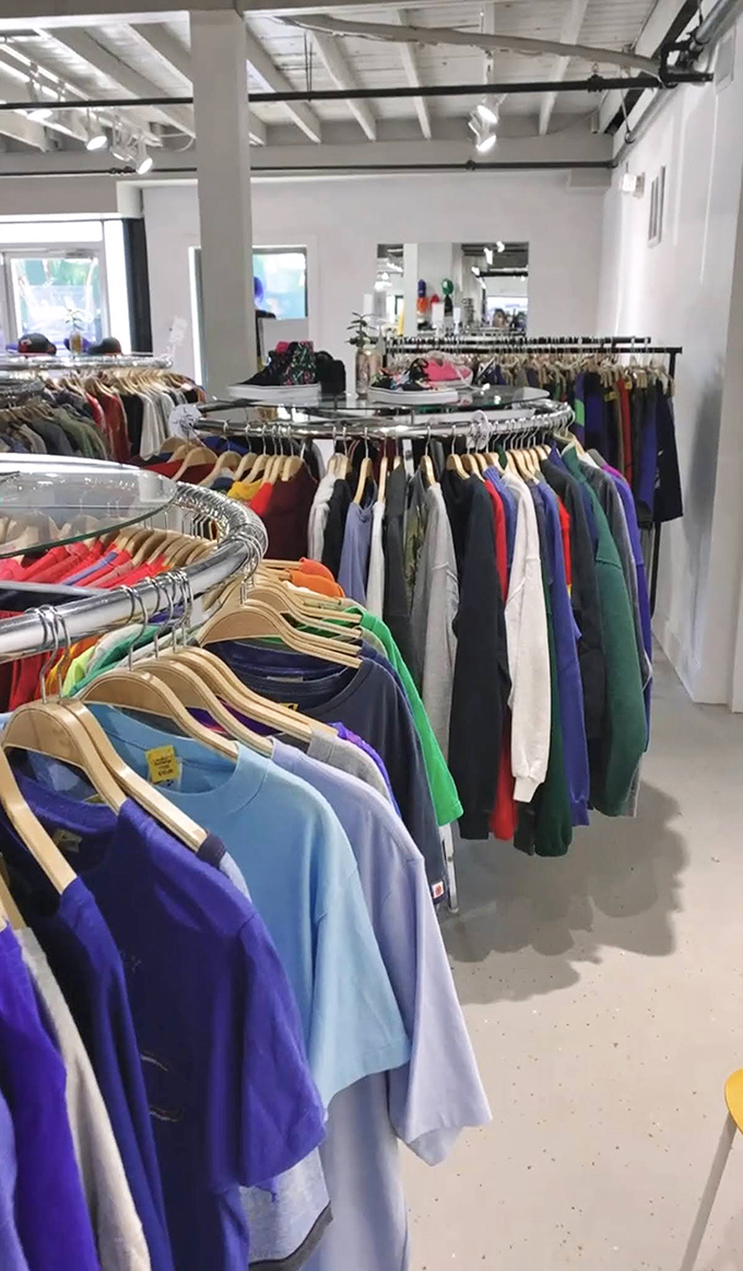 Circular racks create fashion islands to explore, each one potentially hiding that designer gem or vintage masterpiece you didn't know you needed.