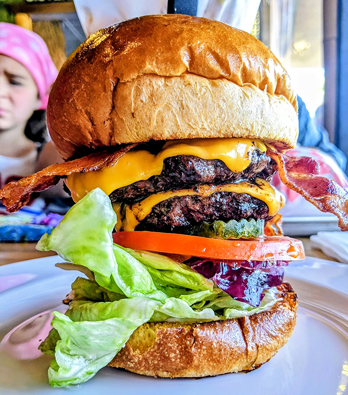 The skyscraper of satisfaction! This towering burger achievement has structural integrity that would impress engineers and flavor that would humble poets.