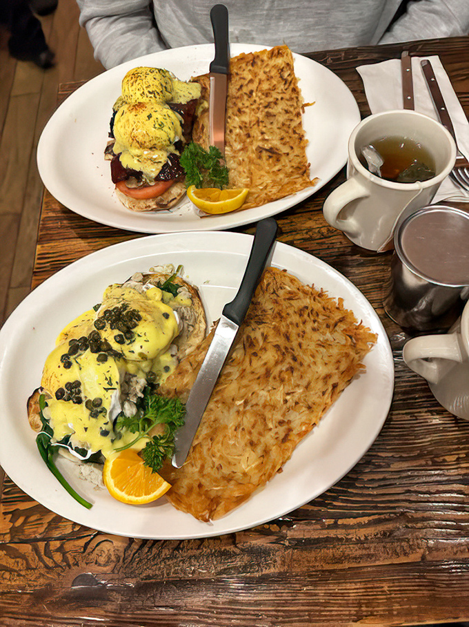 Benedict perfection: poached eggs perched atop their English muffin thrones, crowned with hollandaise and accompanied by the crispiest hash brown rectangle known to humanity.