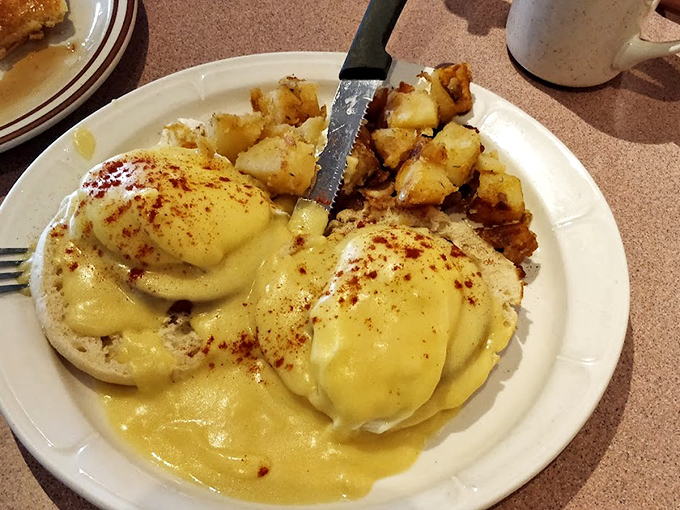 Eggs Benedict that would make the Pope jealous. That hollandaise sauce is practically a religious experience with home fries on the side.