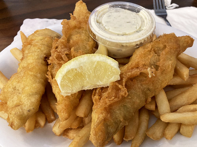 Beer-battered fish so crispy it practically sings, accompanied by fries that deserve their own standing ovation.