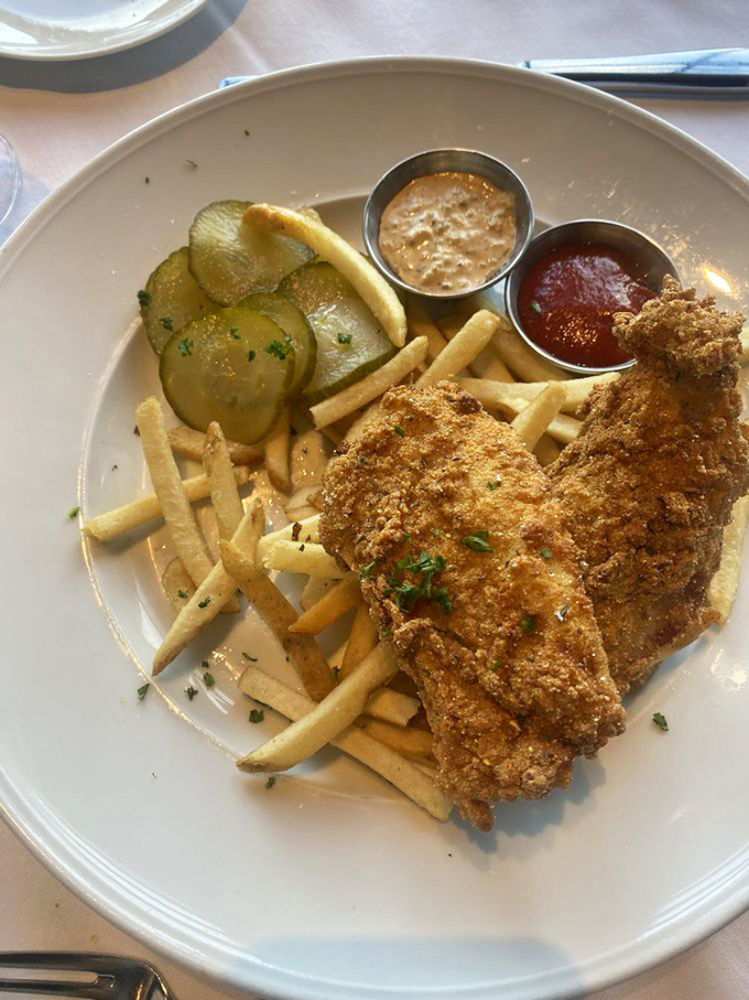 Fish and chips that would make a British pub jealous, with pickles standing by like fresh-faced bouncers guarding the main attraction.