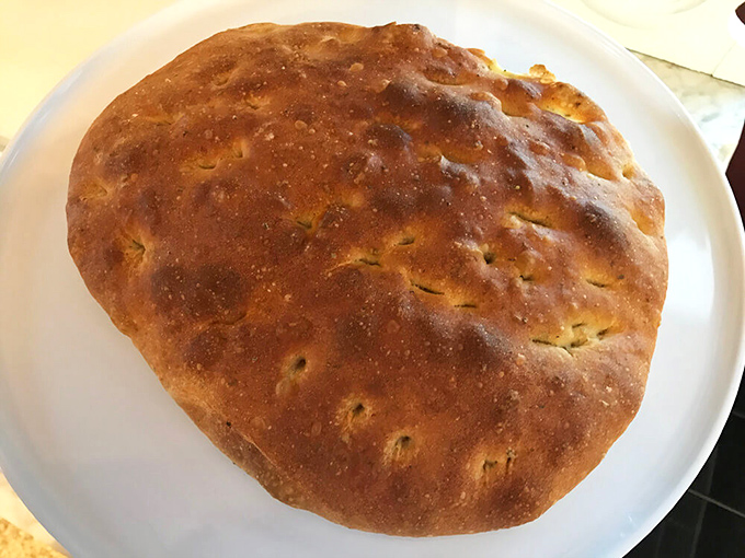 Focaccia that would make an Italian grandmother nod in approval. Golden, dimpled, and ready to transport you to the Mediterranean with each herb-infused bite.