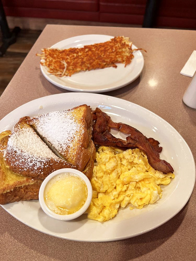 French toast that's dressed for success with a dusting of powdered sugar, ready for its close-up and your imminent food coma.