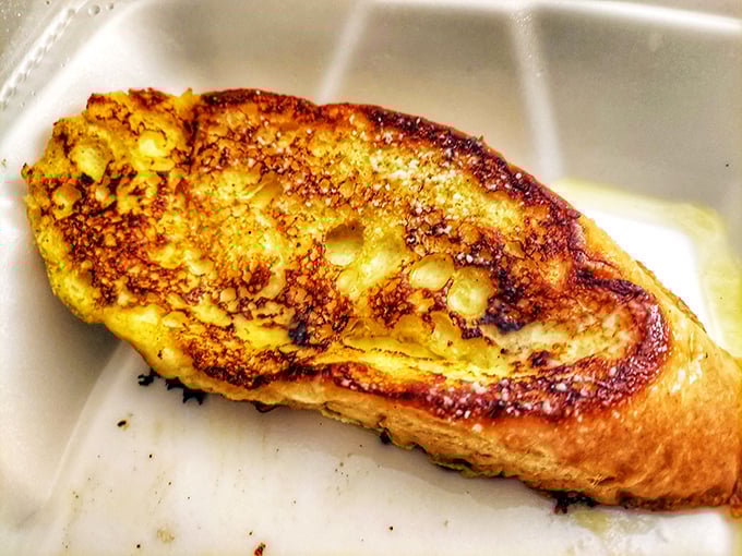 French toast that's achieved the impossible trifecta: crispy edges, custardy center, and the power to make Monday mornings bearable.