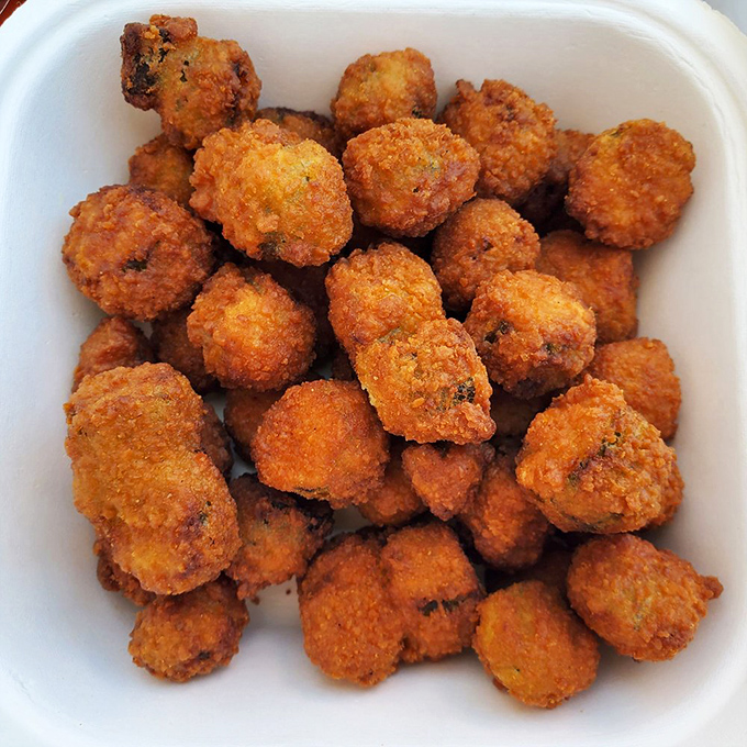 Golden-fried okra nuggets that crunch like nature's popcorn. The perfect Southern side dish that makes you wonder why you don't eat these little gems every day.