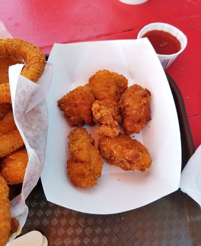 Fried oysters that taste like the ocean decided to dress up in a crunchy tuxedo for dinner.