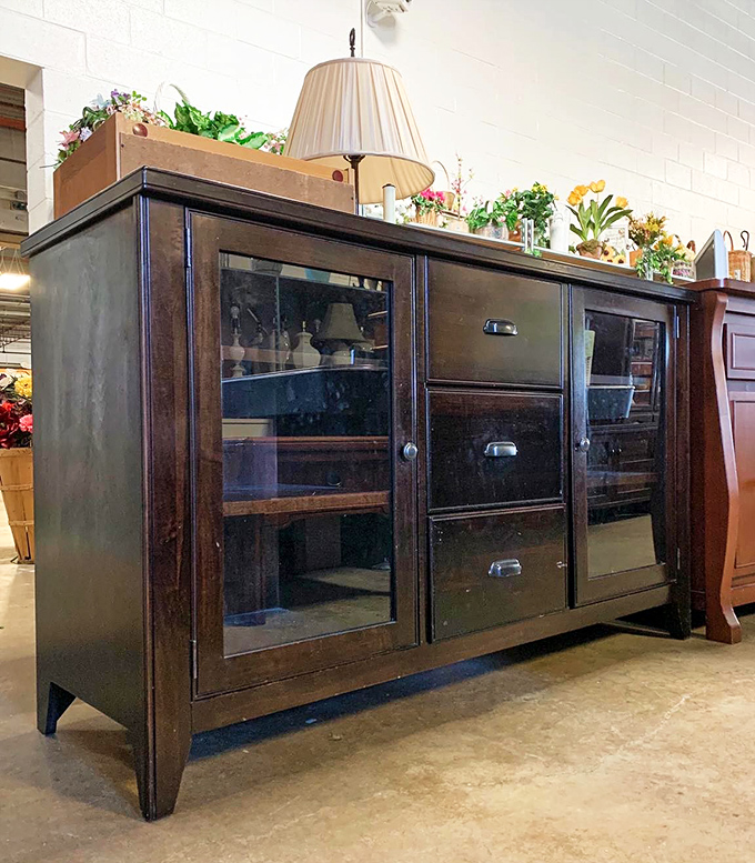 Solid wood craftsmanship that survived one family's history is ready to start a new chapter in your living room.