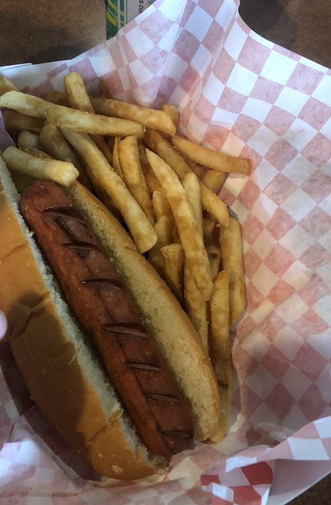 Not just any hot dog&mdash;a smoke-infused revelation nestled in a pillowy bun. The diagonal cuts aren't just for show; they're flavor channels for maximum enjoyment.