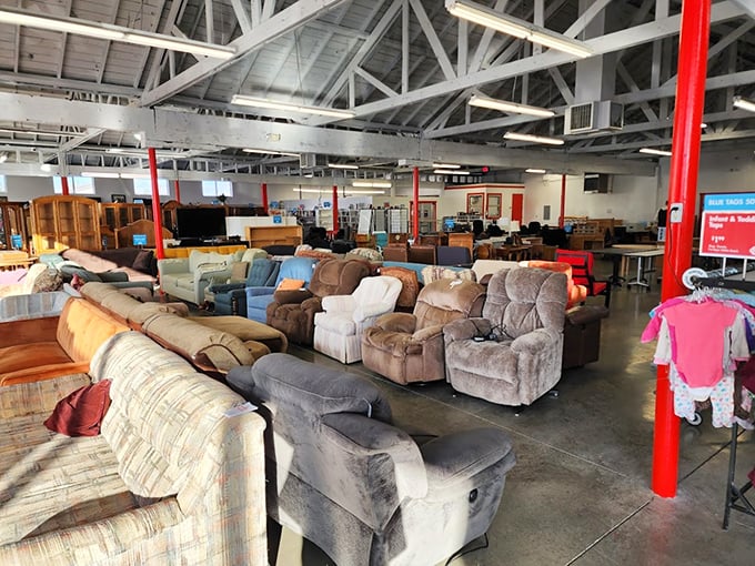 Recliners and sofas stand at attention like an army of comfort, each with battle scars that tell stories of movie nights and Sunday naps.