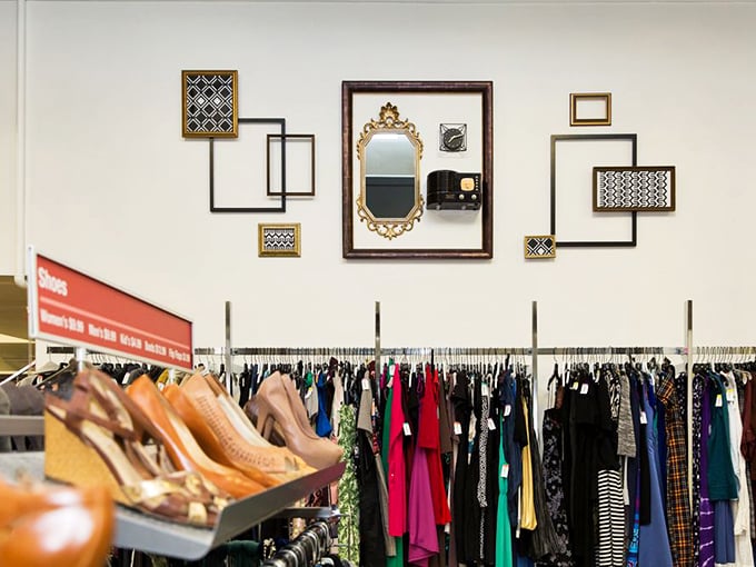 The artistic arrangement of frames creates a gallery-like atmosphere, reminding shoppers that thrifting is both economical and aesthetically rewarding.