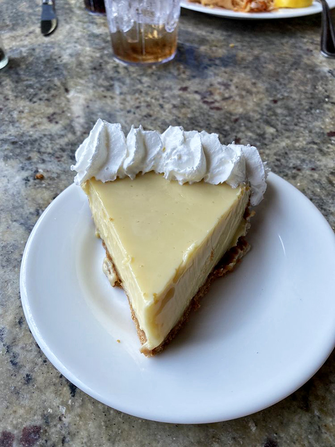 The key lime pie that launched a thousand return visits. Silky, tart-sweet perfection that makes you wonder why you'd ever waste calories on lesser desserts.