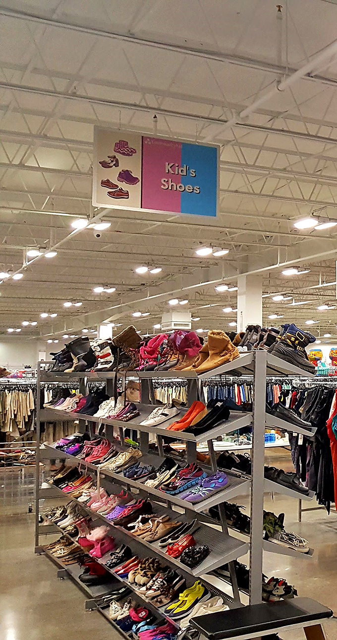 Tiny shoes with tiny price tags line these shelves, proving kids' footwear doesn't need to cost a fortune when they'll outgrow them in three months anyway.