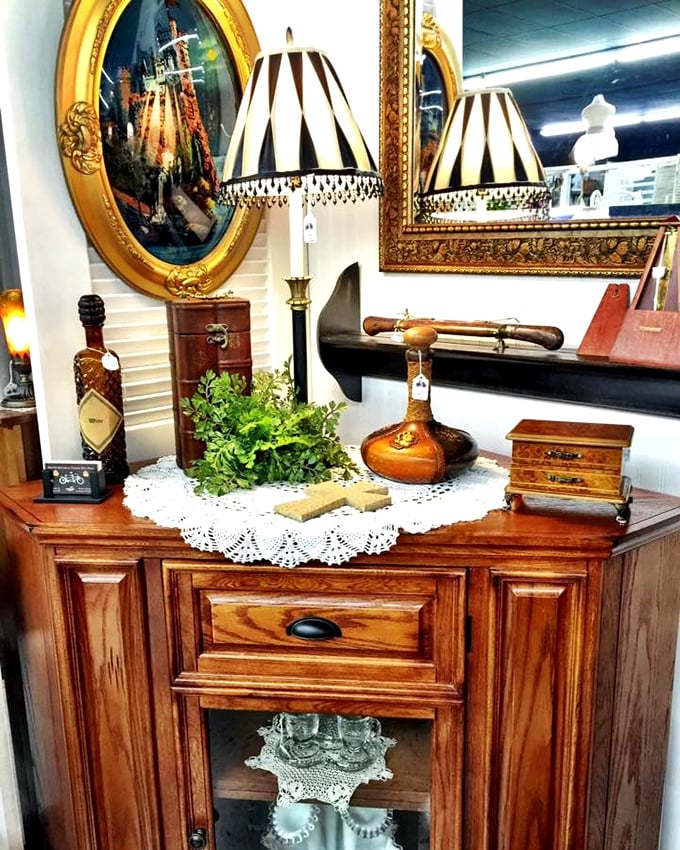 Not your average bedside setup. Those striped lampshades and ornate mirrors transform ordinary furniture into extraordinary statement pieces.