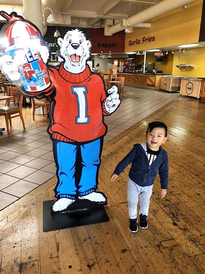 Childhood joy meets mascot magic. This little shopper's smile is worth more than all the discounts combined.