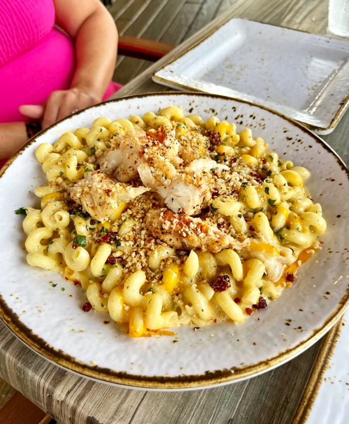 Mac and cheese gets the Florida treatment with plump chunks of seafood nestled among creamy spirals. Comfort food with a coastal upgrade.