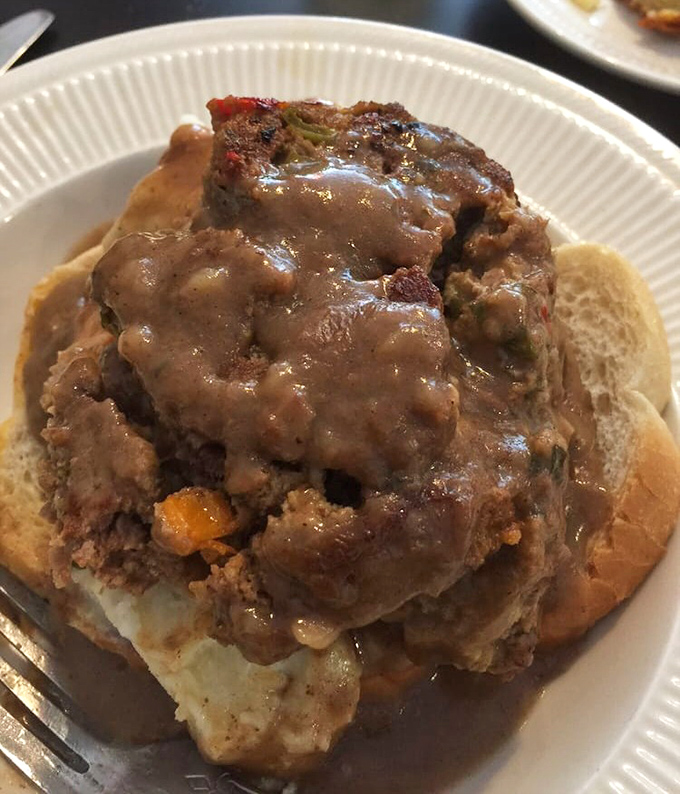 Mike's Meatloaf Sandwich &ndash; where comfort food goes to show off. This open-faced beauty smothered in gravy is the culinary equivalent of a warm hug.