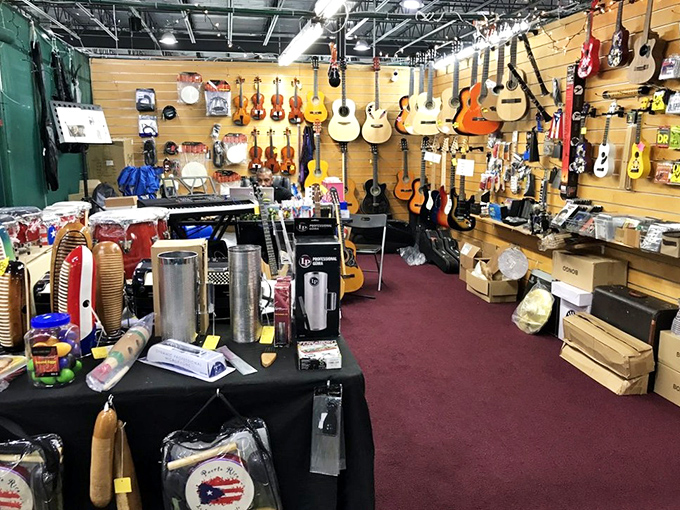 String theory takes physical form in this musical corner, where guitars hang like ripening fruit waiting to be plucked by the next Florida Clapton.