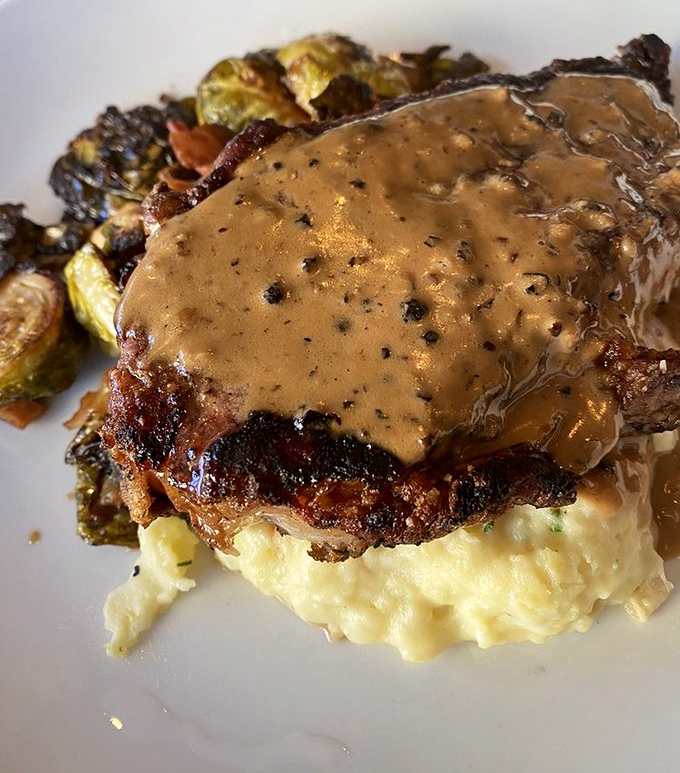 Perched atop creamy mashed potatoes with perfectly cooked green beans, this New York strip is the celebrity your dinner table has been waiting for.