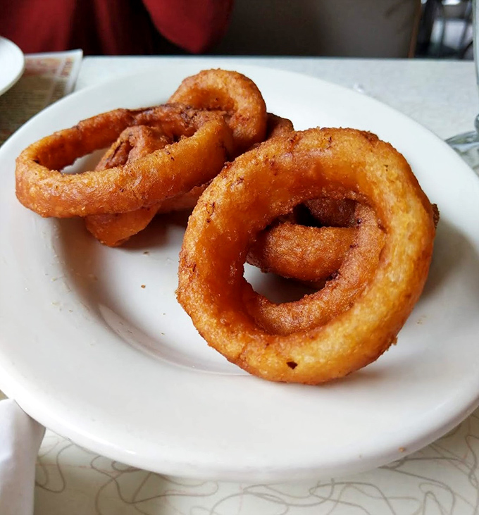 Golden onion rings that crunch like autumn leaves. These aren't just sides &ndash; they're main attractions in their own right.