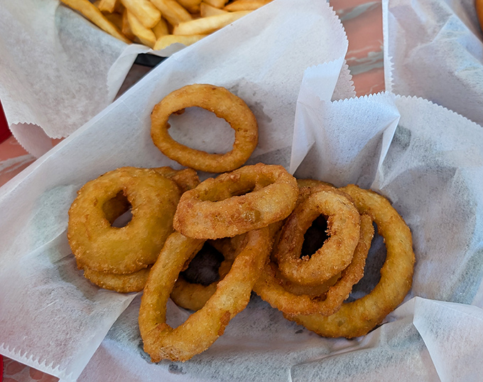 Golden, crispy onion rings that shatter with each bite &ndash; the supporting actors that sometimes steal the show from the headlining cheesesteak.