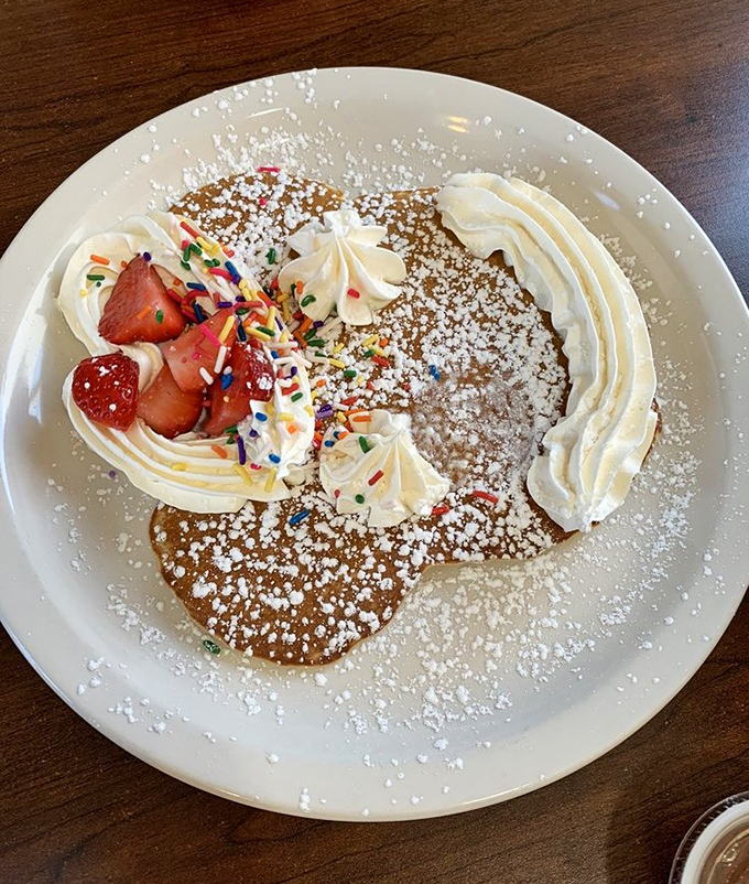 A pancake adorned with fresh strawberries and whipped cream&mdash;proof that sometimes the prettiest foods are also the most delicious.