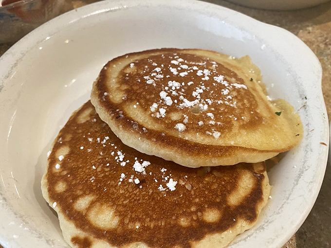 Golden pancakes dusted with powdered sugar—the breakfast equivalent of a perfect vinyl record. Simple, timeless, and utterly satisfying.