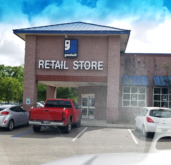 Sorting bins stretch into the distance like a sea of possibility. Each container holds someone's castoffs ready to become another's treasure.