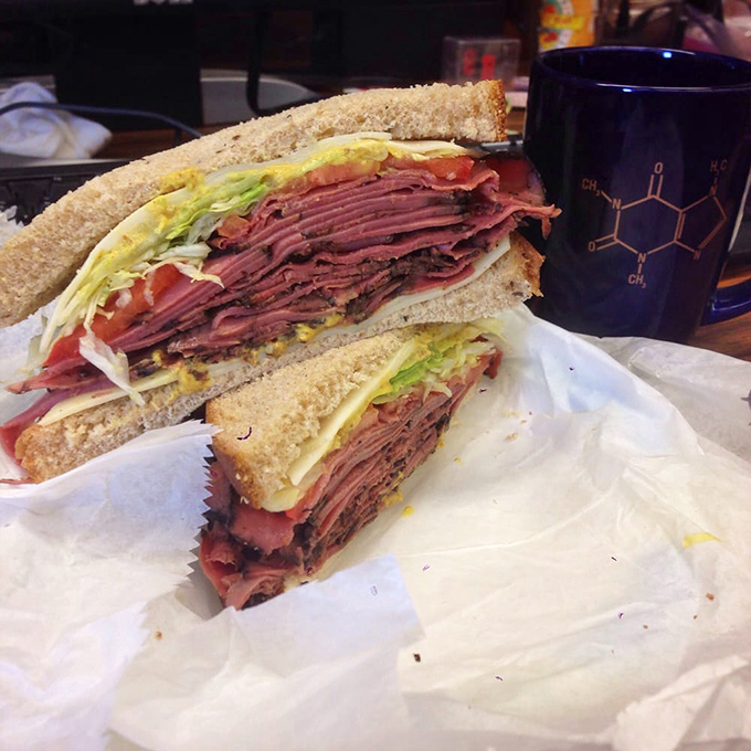 Pastrami stacked higher than Manhattan rent prices, with just enough greenery to make you feel virtuous about your gloriously indulgent choice.