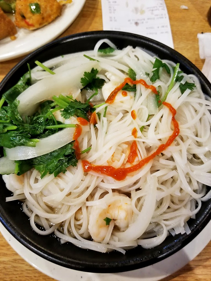 Delicate rice noodles swimming in fragrant broth with fresh herbs &ndash; proof that sometimes the most comforting foods are also the most elegant.