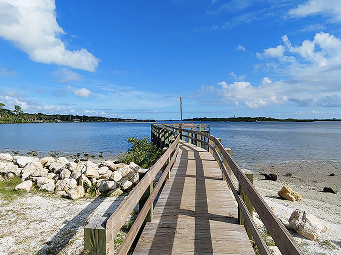 This weathered wooden pier stretches toward tranquility. Morning walks here come with complimentary dolphin sightings if you're patient.