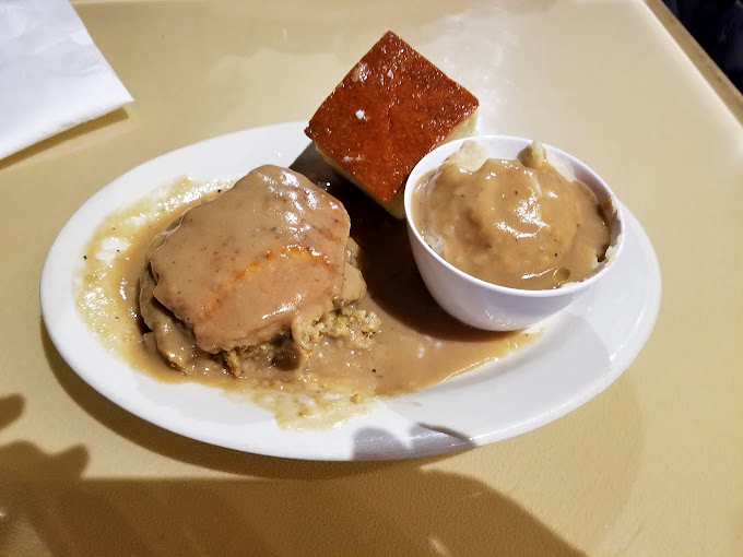 Some pork chops are just food. This gravy-smothered masterpiece is therapy&mdash;the kind that makes you close your eyes and forget your problems.