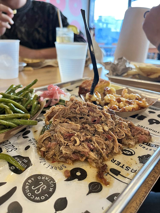 Pulled pork piled high in its natural glory. No need for swimming pools of sauce when the meat speaks this eloquently for itself.