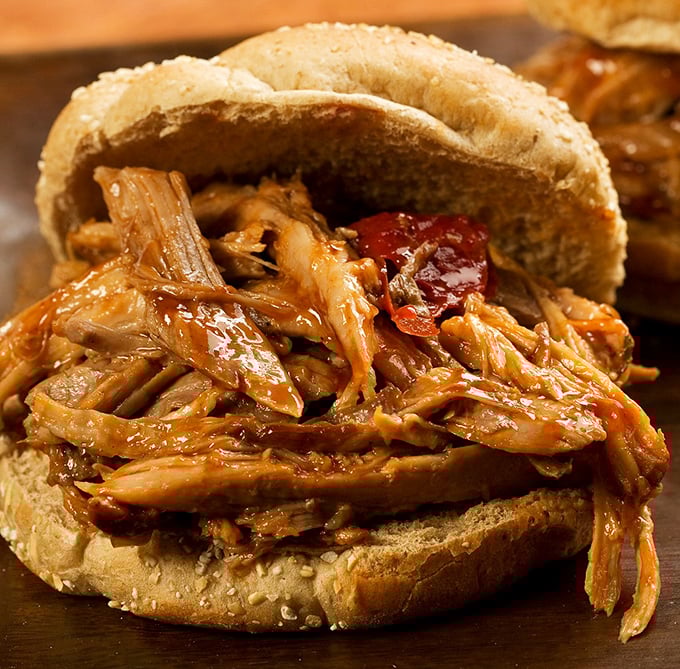 This isn't just a pulled pork sandwich &ndash; it's a masterclass in texture and flavor. The kind of sandwich that demands both hands and your full attention.