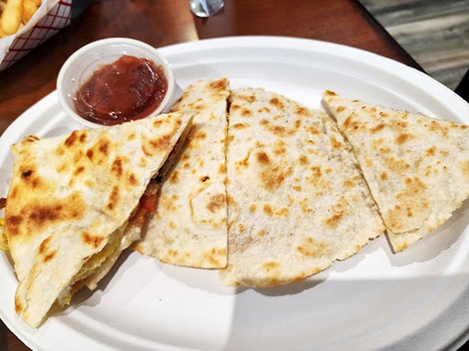 Golden-brown quesadilla triangles with that perfect cheese pull hiding inside. The little cup of salsa is just waiting to take this relationship to the next level.