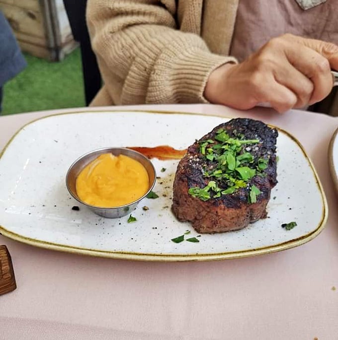 Ribeye perfection that would make Fred Flintstone weep with joy. The marbling, the crust, the juicy interior&mdash;it's the holy trinity of steakdom.