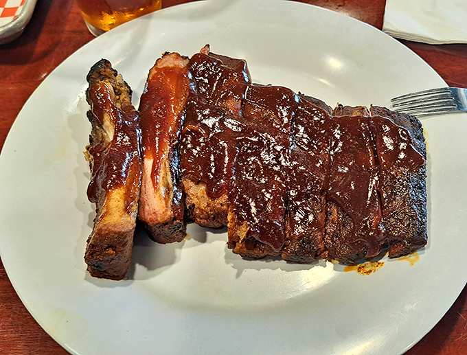 BBQ ribs so tender they practically leap off the bone. The sauce-to-meat ratio here deserves a mathematical theorem named after it.