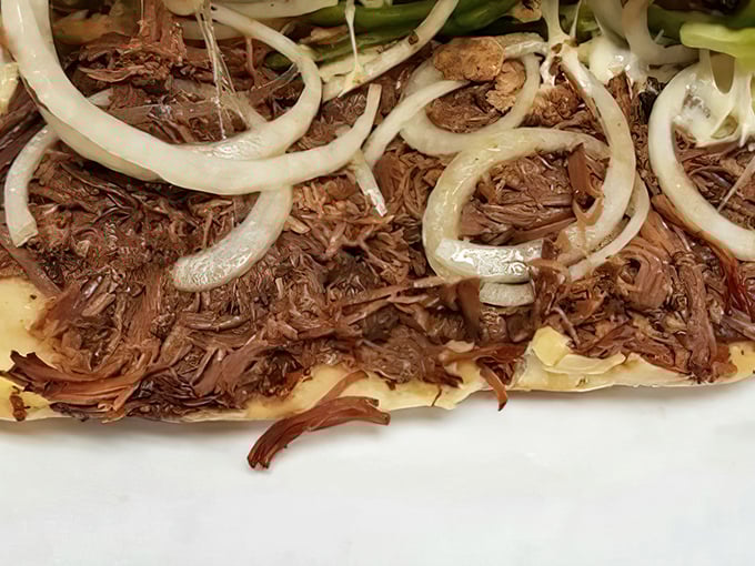 Tender shredded beef topped with saut&eacute;ed onions&mdash;proof that sometimes the simplest combinations create the most profound flavor experiences.